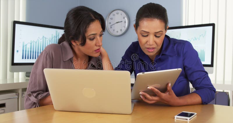 Close Up of Smiling Hispanic Business Woman in Office Looking at Camera ... Close Up of Smiling Hispanic Business Woman in Office Looking at Camera ...