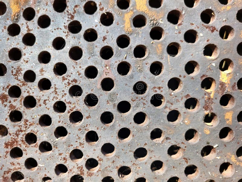 Black Holes in Old Rusty Metal Stock Image - Image of industrial, metal ...