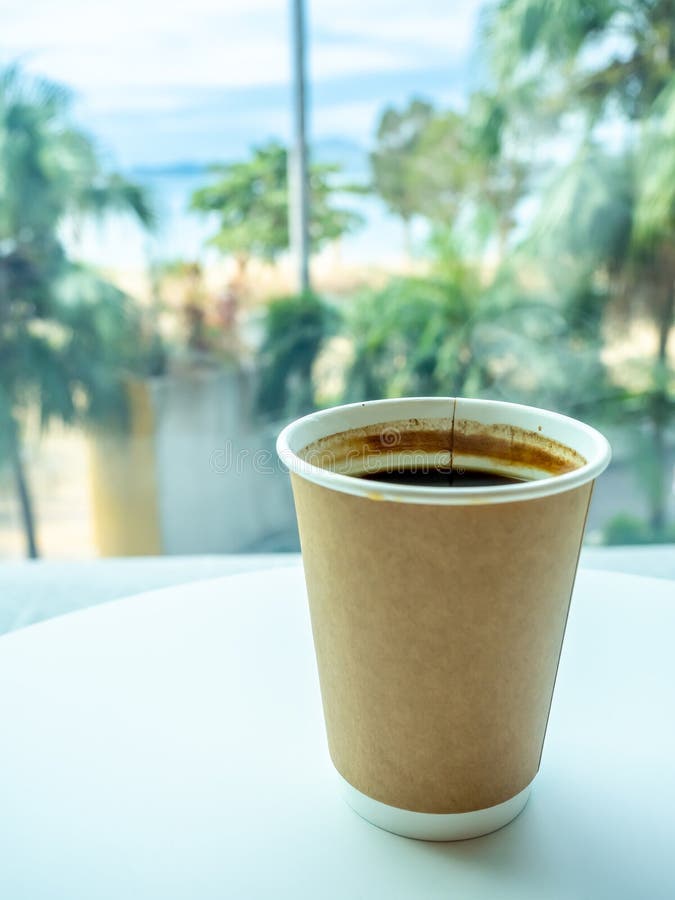 Americano, in Paper Coffee Cup, Place on the Table in the Morning Time ...