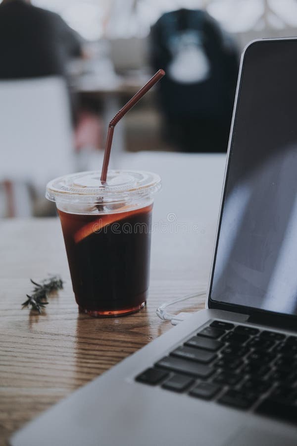 Black Iced Coffee with a Notebook on Wood Table Stock Image - Image of ...