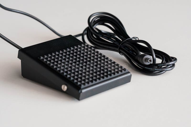 Black Industrial Foot Pedal Switch with Textured Surface and Attached ...