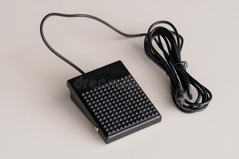 Black Industrial Footswitch Pedal with Cable on Beige Surface Stock ...
