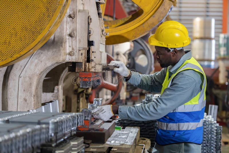 Black Industrial Worker Using Hydraulic Power Press Machine Stock Photo ...