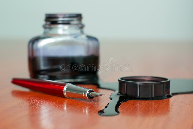 Black Ink Spill Near Red Pen on Table Stock Image - Image of spill ...