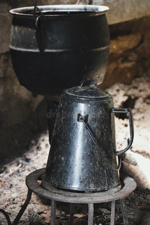 Black Iron Pot and Kettle in Stone Fireplace Stock Image - Image of ...
