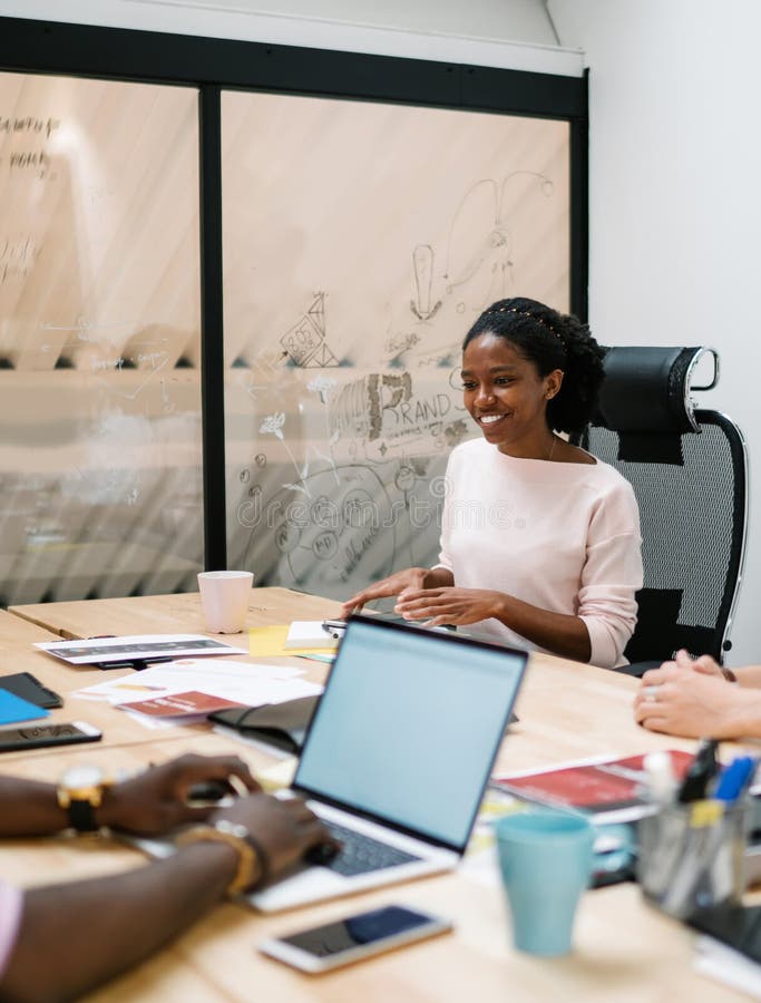 Black Joyful Office Worker Sharing Ideas with Partners Stock Photo ...