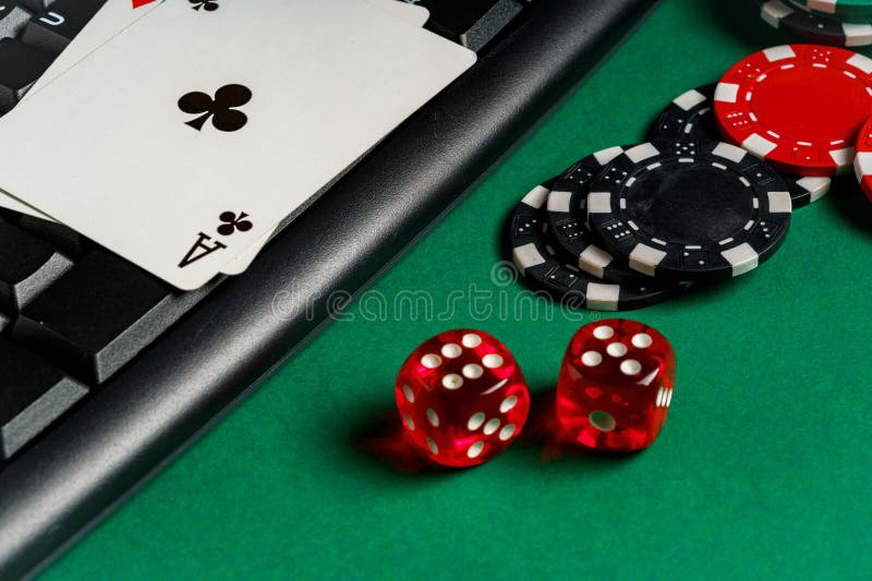 Black Keyboard, Playing Cards, Dice, and Chips on Green Felt Tabletop ...