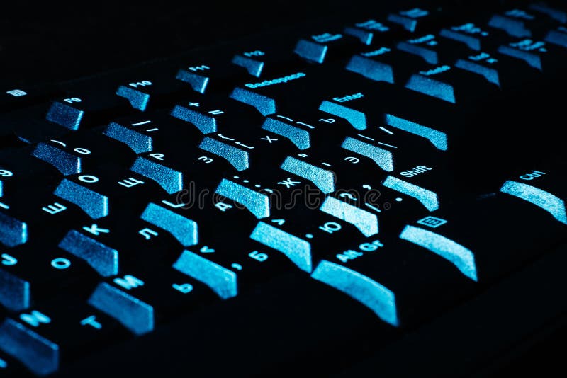 Black Keyboard with Russian Layout Illuminated by Blue Light Stock ...