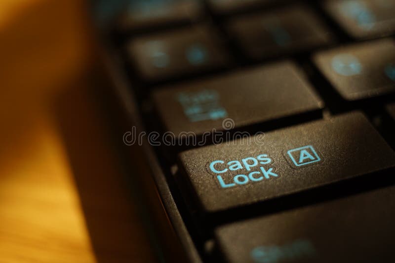 Black Keyboard on the Sunny Table Closeup. Focus on Key Caps Lock Stock ...