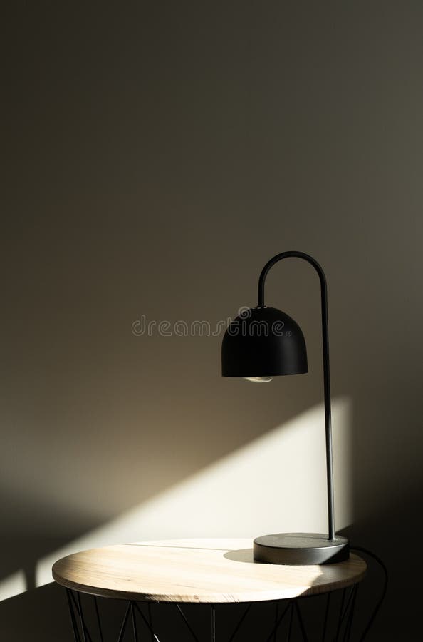 Black Lamp on the Table with Sun Light Near Bed Stock Photo - Image of ...