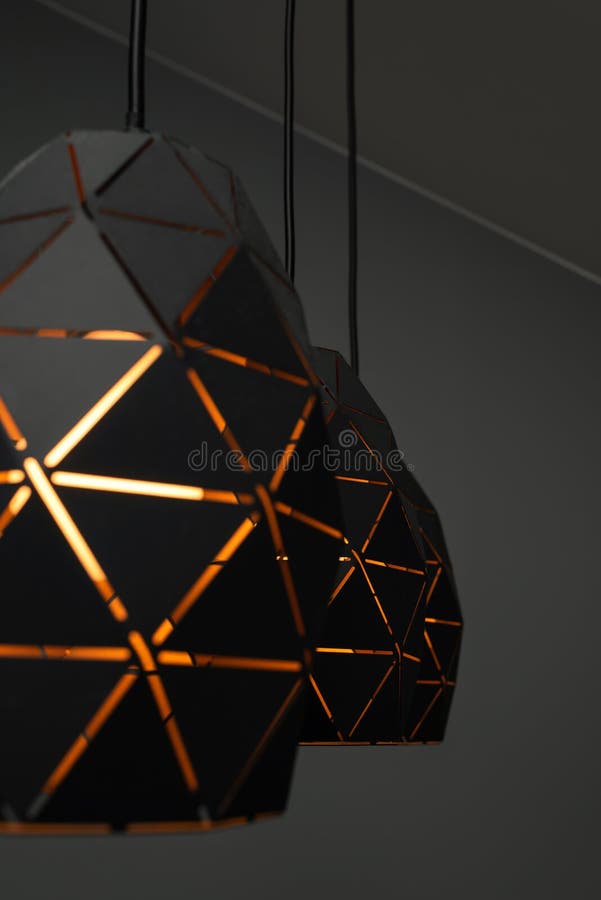 Black Lamps with a Geometric Pattern, Three Lamps on a Black Background ...