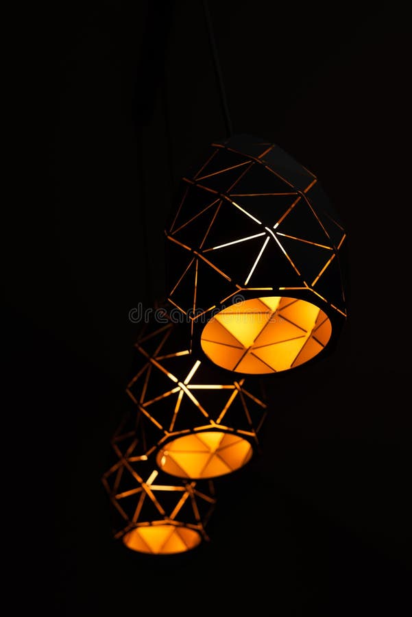 Black Lamps with a Geometric Pattern, Three Lamps on a Black Background ...