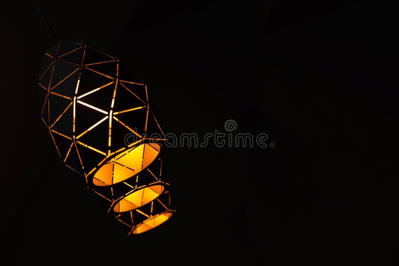 Black Lamps with a Geometric Pattern, Three Lamps on a Black Background ...