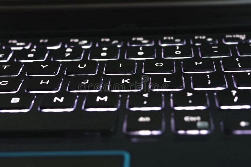 Black Laptop Keyboard with Letters Backlit in Neon Blue. Stock Image ...