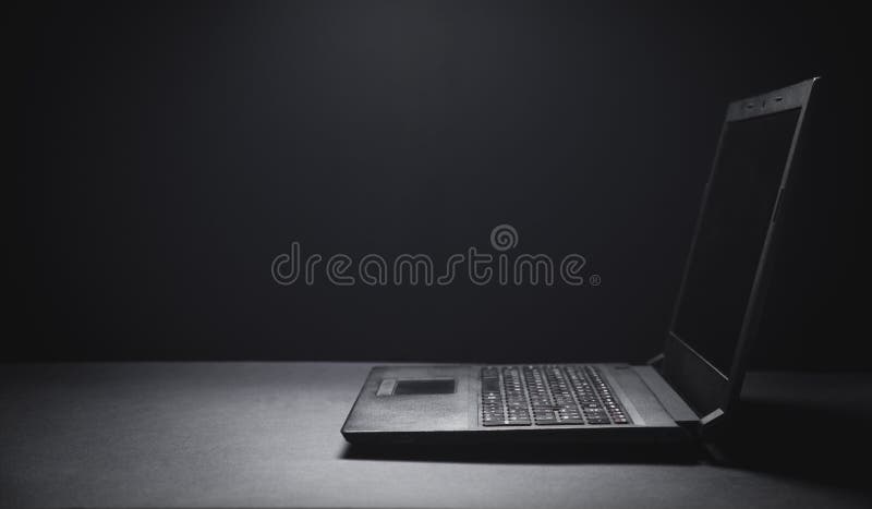 Black Laptop on the Black Office Desk. Technology Concept Stock Photo ...