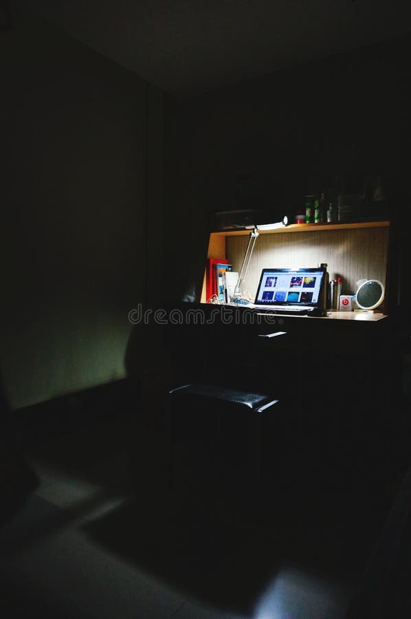 Black Laptop In Study Table Near Lamp Stock Image - Image of dark ...