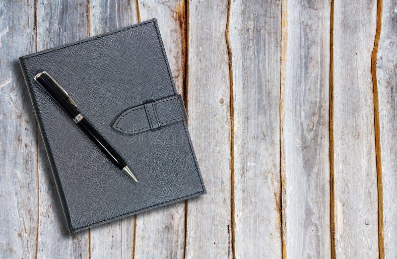 Black Leather Notebook with Pen Stock Photo - Image of doors, ancient ...
