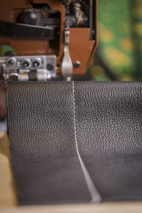 Black Leather Stitching in Front of a Commercial Sewing Machine Stock ...