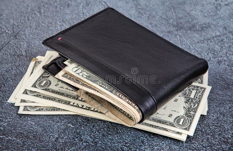 Black Leather Wallet with Dollar Bills on Asphalt Background. Toned ...