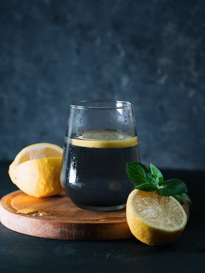 Black Lemonade with Mint, Lemon, Charcoal and Ice Stock Image - Image ...