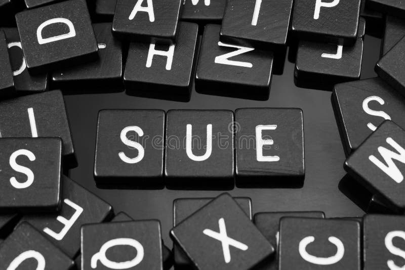 Black Letter Tiles Spelling the Word & X22;sue& X22; Stock Photo ...