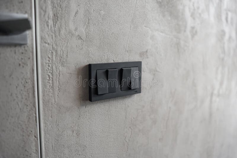 Black Light Switch Keys on a Gray Wall. Stock Photo - Image of light ...