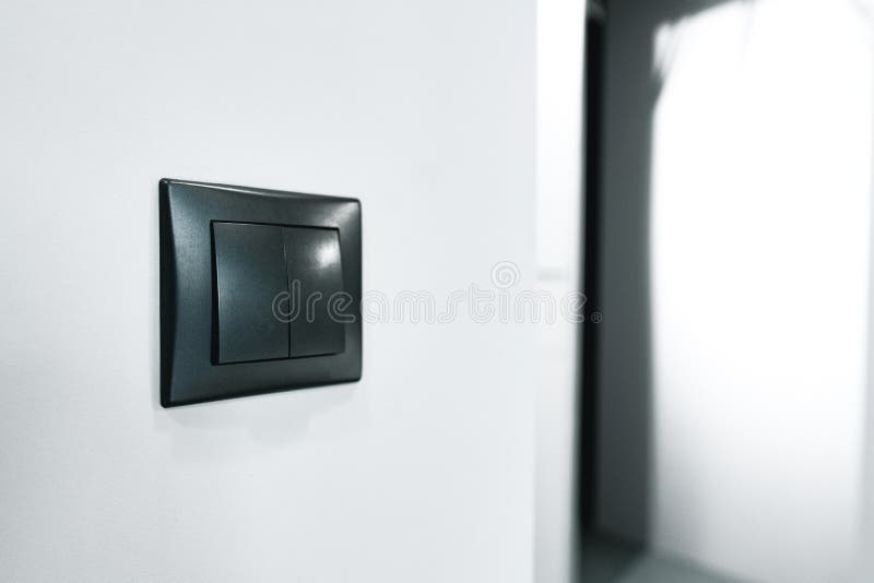 A Black Light Switch on White Wall Stock Image - Image of electrical ...
