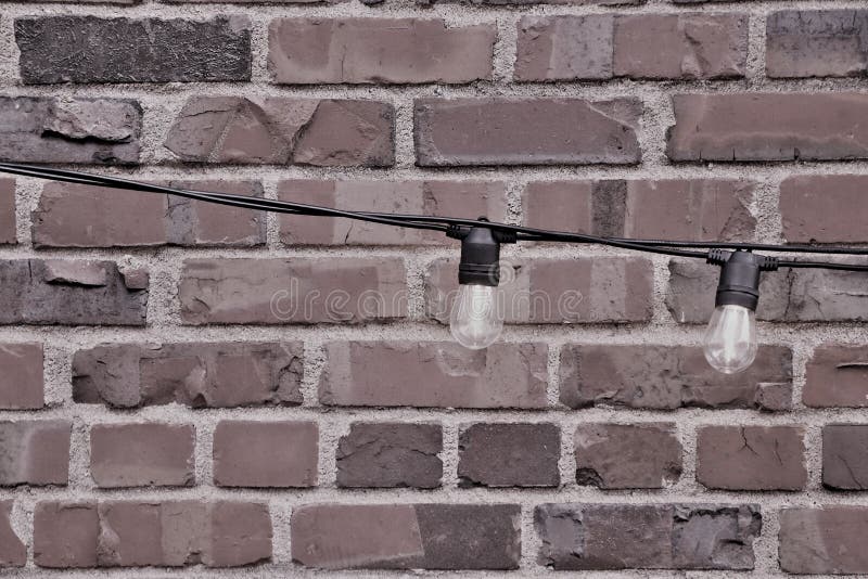 Black Lightbulb String on Muted Red Brick, Horizontal Stock Image ...