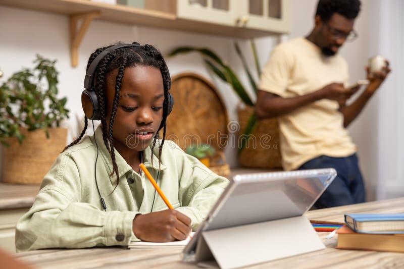 Black Little Girl Taking Class Online Using Digital Tablet Stock Image ...