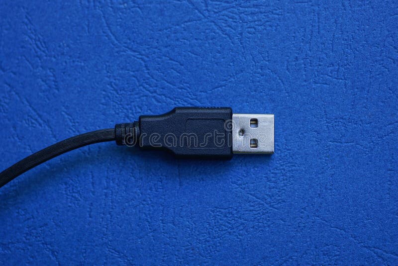 Long Usb Cord with Plug on a Blue Table Stock Photo - Image of electric ...