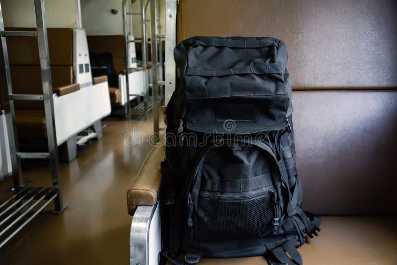 Black luggage on a chair stock photo. Image of rail - 101299392