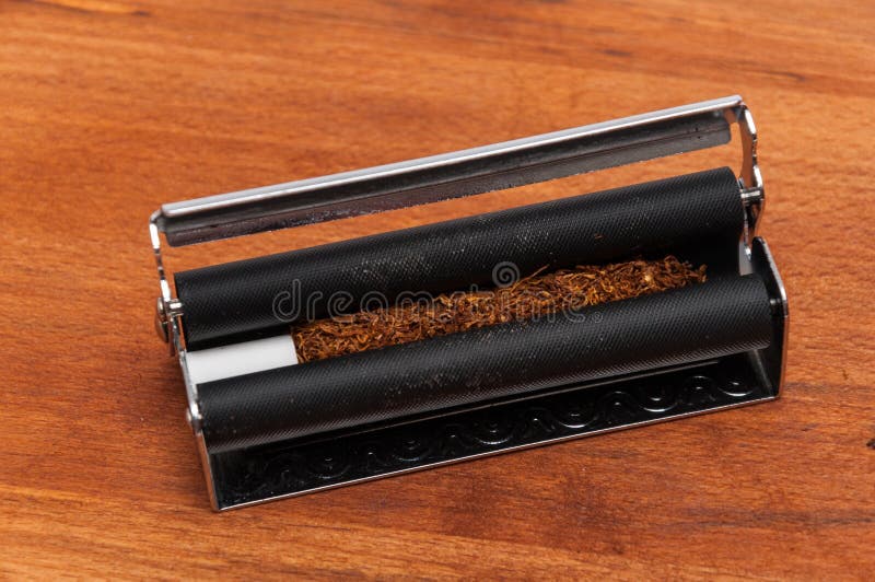 Hand Rolling Tobacco with the Filter in the Machine Stock Photo - Image ... Hand Rolling Tobacco with the Filter in the Machine Stock Photo - Image ...