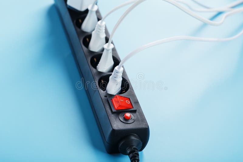 A Black Mains Filter with Electrical Outlets Inserted into it with ...