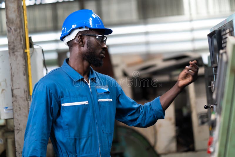 Black Male Engineer Working on Machine in Factory. Black Man Engineer ...