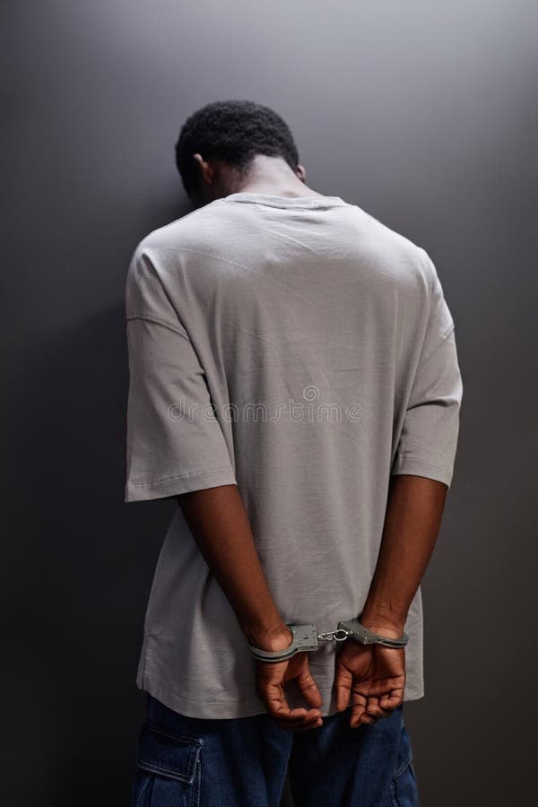 Minimal Black Young Man Wearing Handcuffs Crying in Remorse As Criminal ...