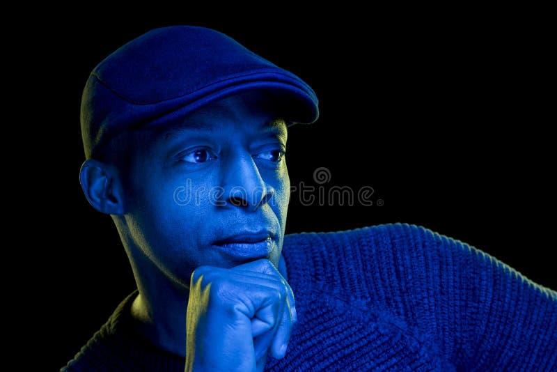 Black Man with Blue and Yellow Light, Thoughtful Concept. Stock Image ...