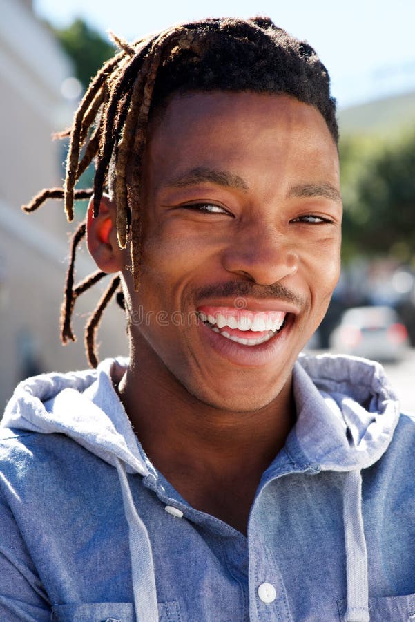 Black Man with Dreadlocks Laughing Outdoors Stock Photo - Image of ...