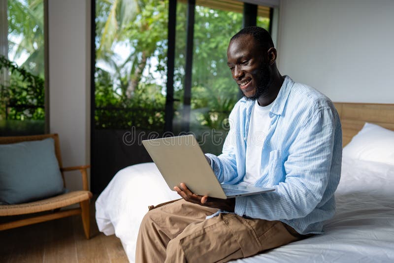 Black Man Enjoying the Endless Possibilities of the Internet, Exploring ...