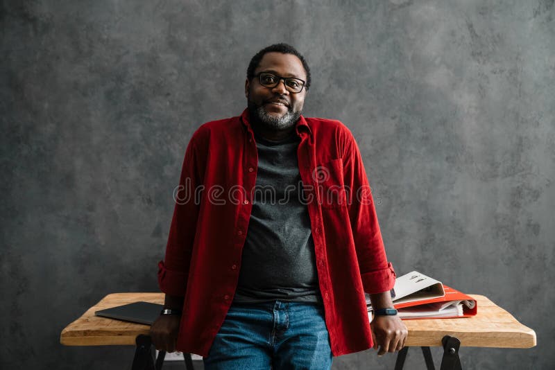 Black Man in Eyeglasses Smiling while Working in Office Stock Photo ...