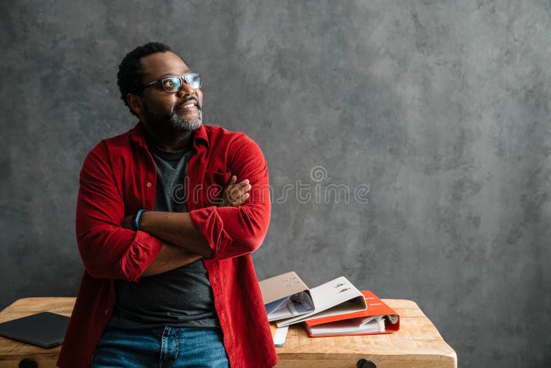 Black Man in Eyeglasses Smiling while Working in Office Stock Photo ...