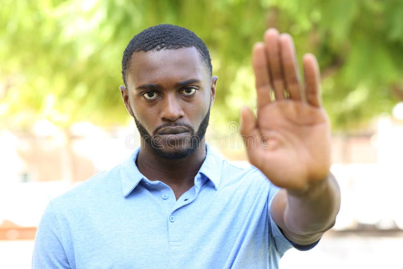 Black Man Gesturing Stop Sign in a Park Stock Image - Image of ...