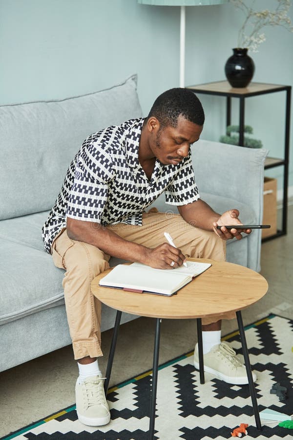 Black Man at Home Managing Tasks in Planner Stock Image - Image of ...