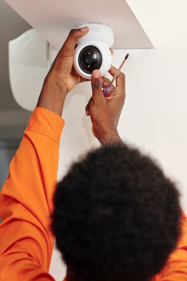 Black Man Installing Security Camera Stock Image - Image of lifestyles ...
