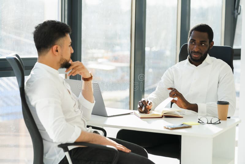 Black Man Interviewing New Employee in Company Office. Stock Photo ...