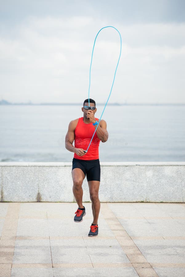 Black Athlete Doing Power Skips before Running Stock Photo - Image of ...