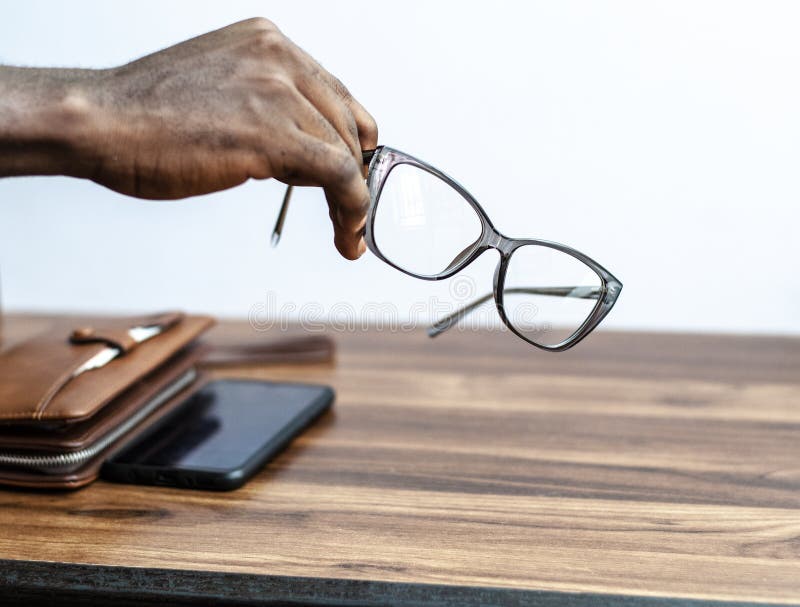 Picking spectacle up stock photo. Image of black, brown - 193162430