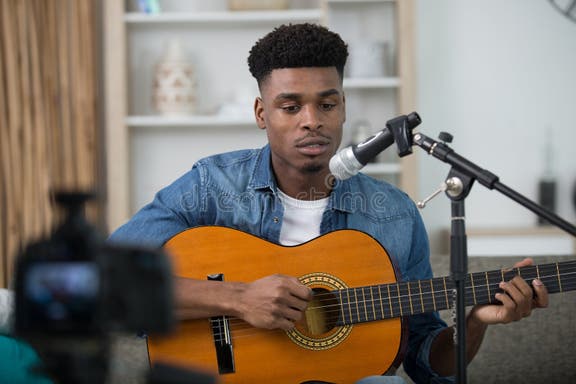 Black man playing guitar stock image. Image of portrait - 280479395