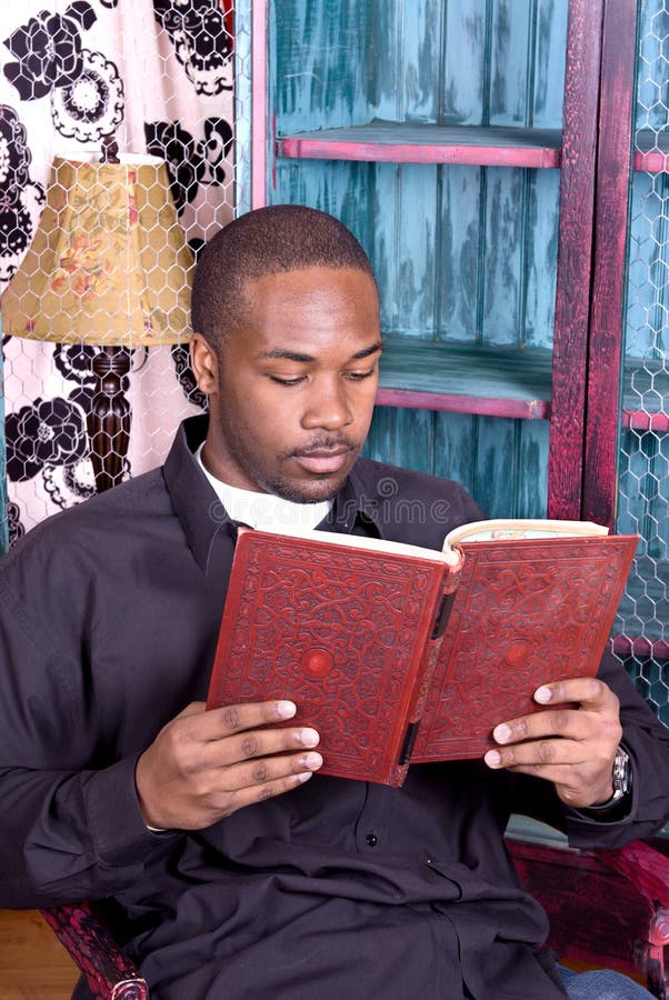 Black man reading a book stock image. Image of room, learning - 20730245