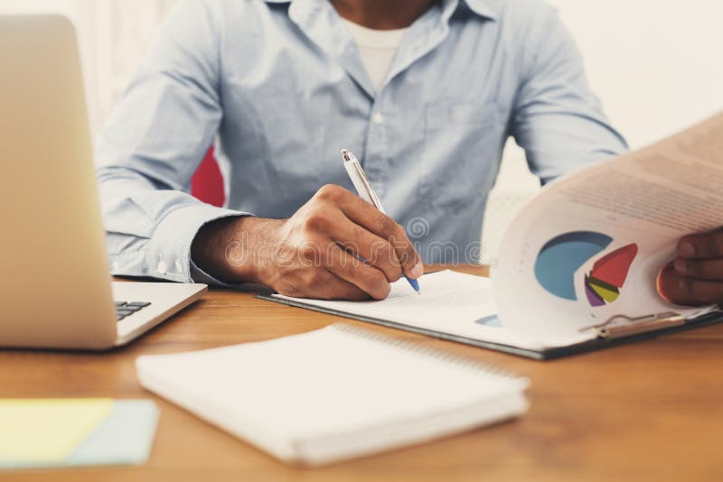 Black Man Reading Documents in Modern Office Stock Image - Image of ...