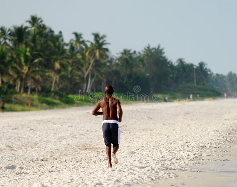 Black man running on beach stock photo. Image of shoreline - 3012126